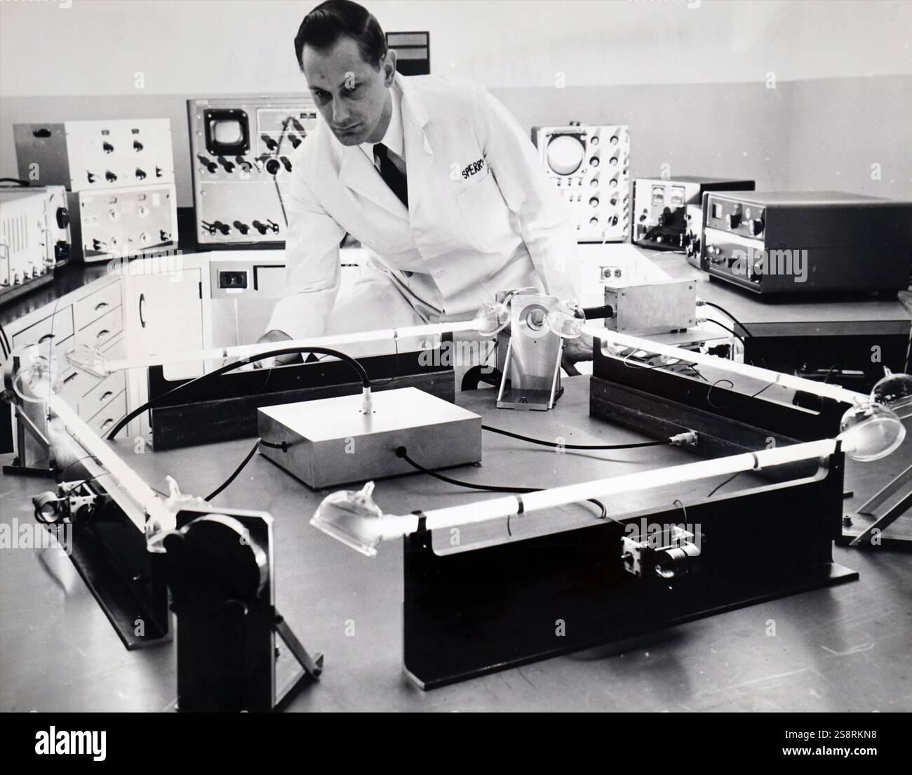 Photograph of a scientist testing a 'closed-circuit' laser that appears ...