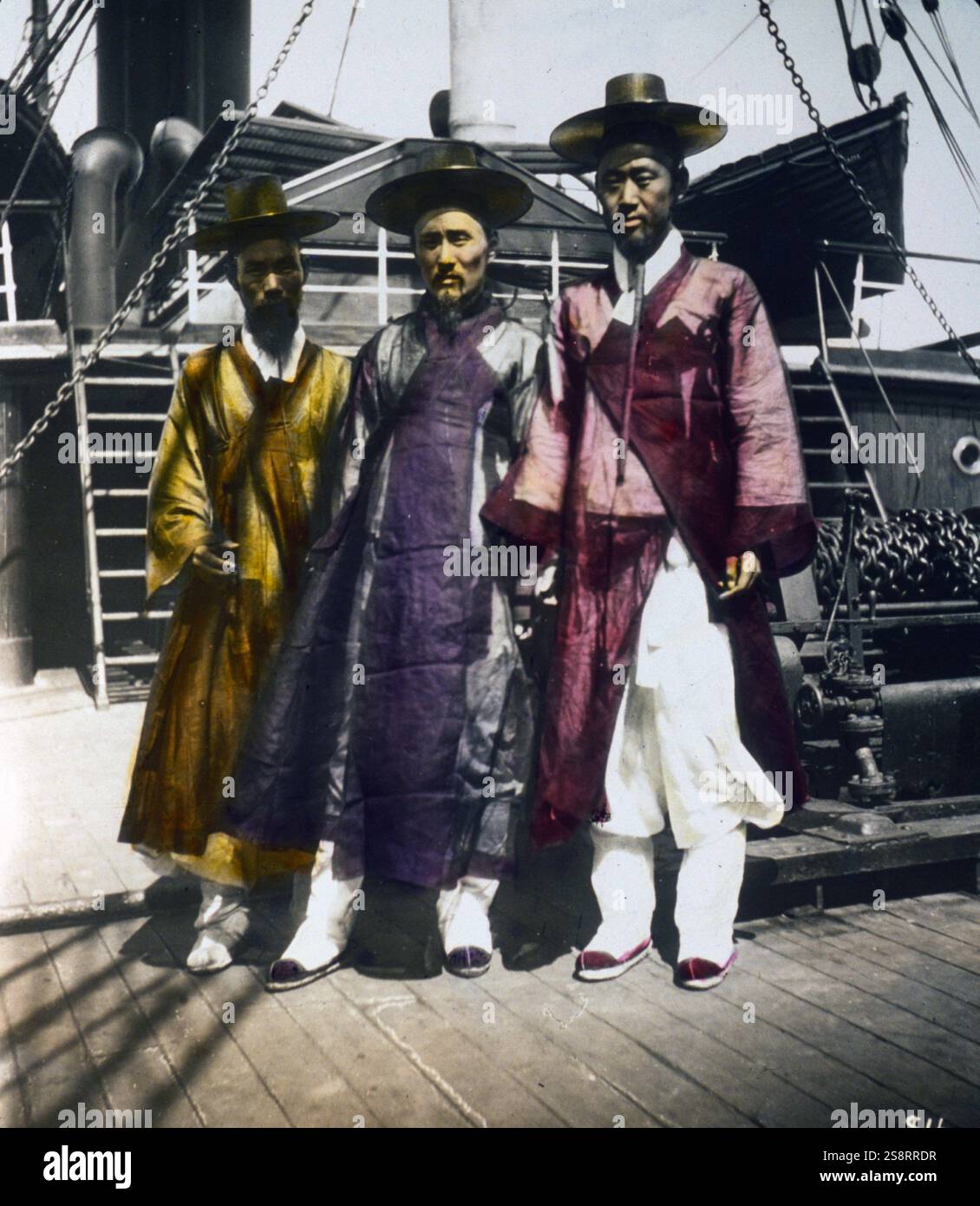 Korean business traders on board a ship on the Korean coast. Circa 1895 ...