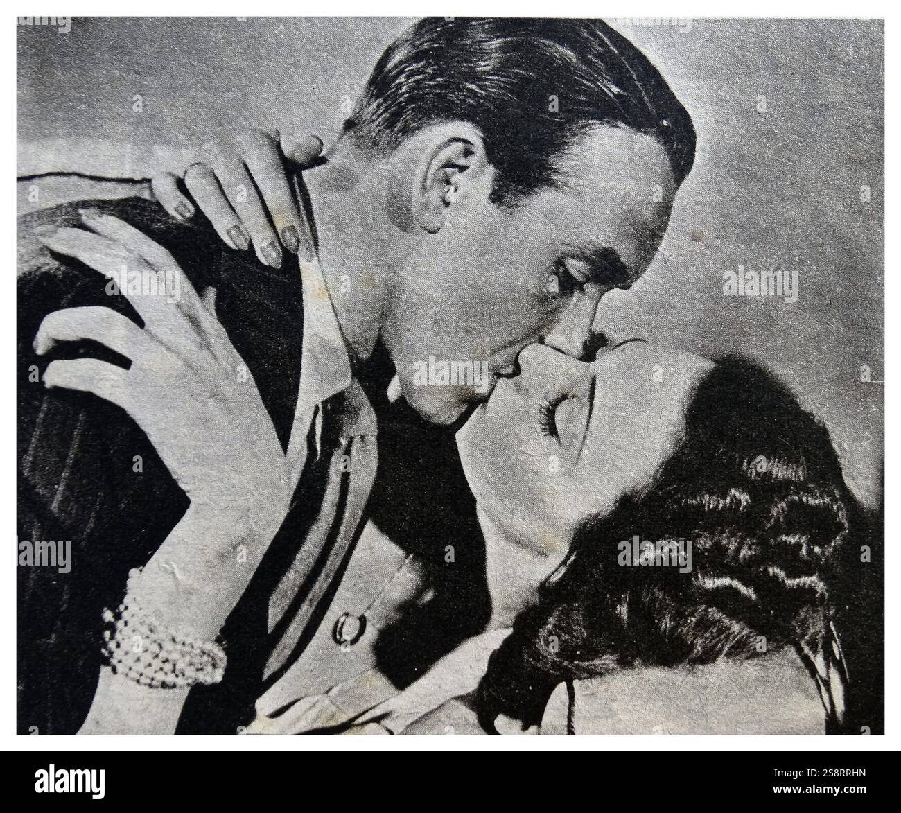 Barry K. Barnes and Judy Kelly kissing in a scene from The Midas Touch, a 1940 British thriller ...