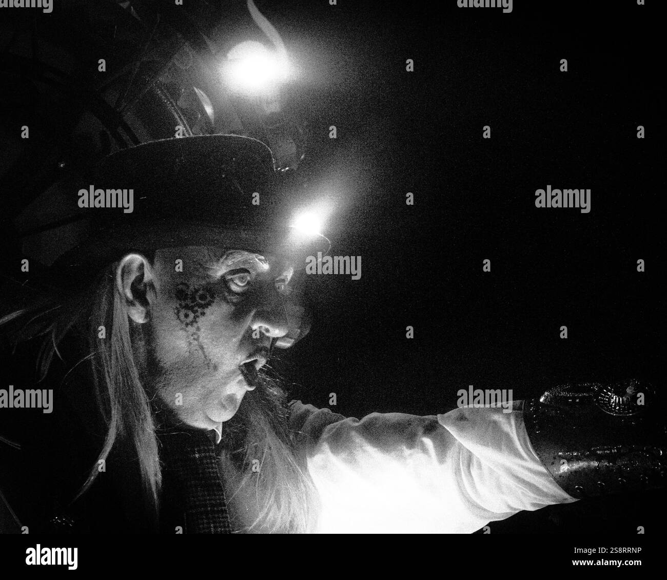 Black and white picture of spooky mysterious long-haired man in a ...