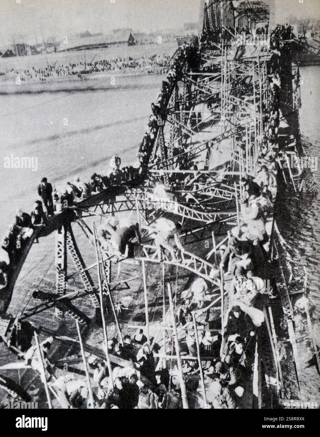 Korean War: Thousands of North Korean crossing a partly destroyed ...