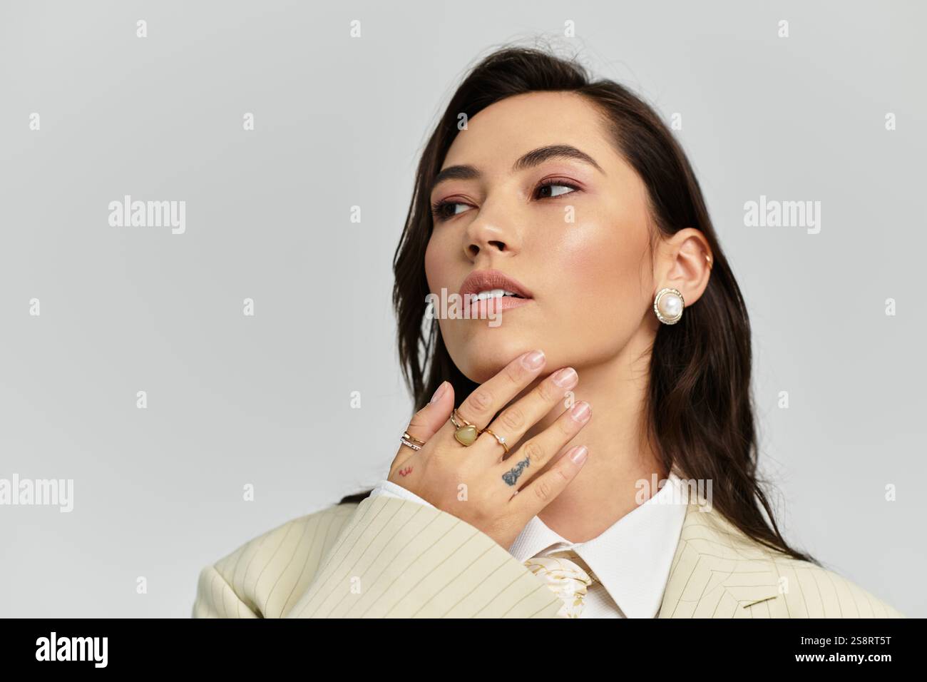 A beautiful young woman showcases her fashion sense and grace while ...