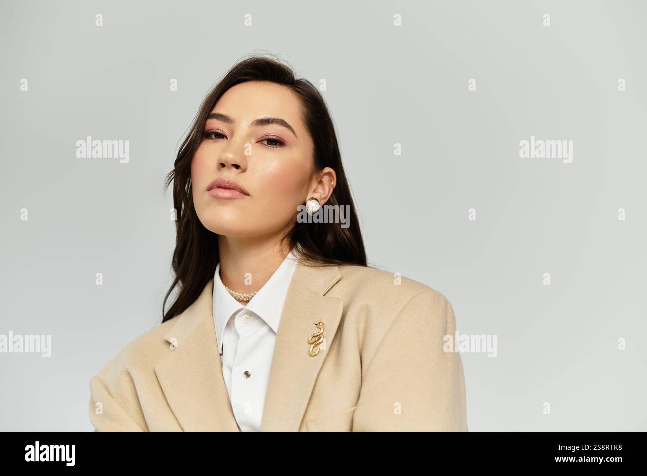 A beautiful woman poses confidently, showcasing her stylish outfit and ...