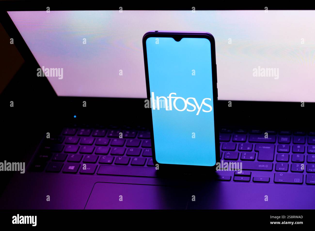 In this photo illustration, the Infosys Limited logo is seen displayed ...
