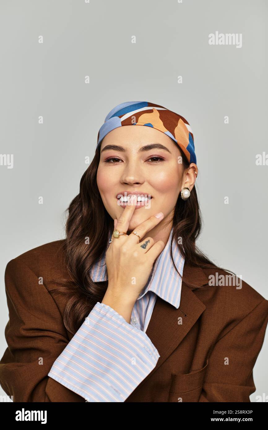 A beautiful woman showcases her unique fashion sense with a playful ...