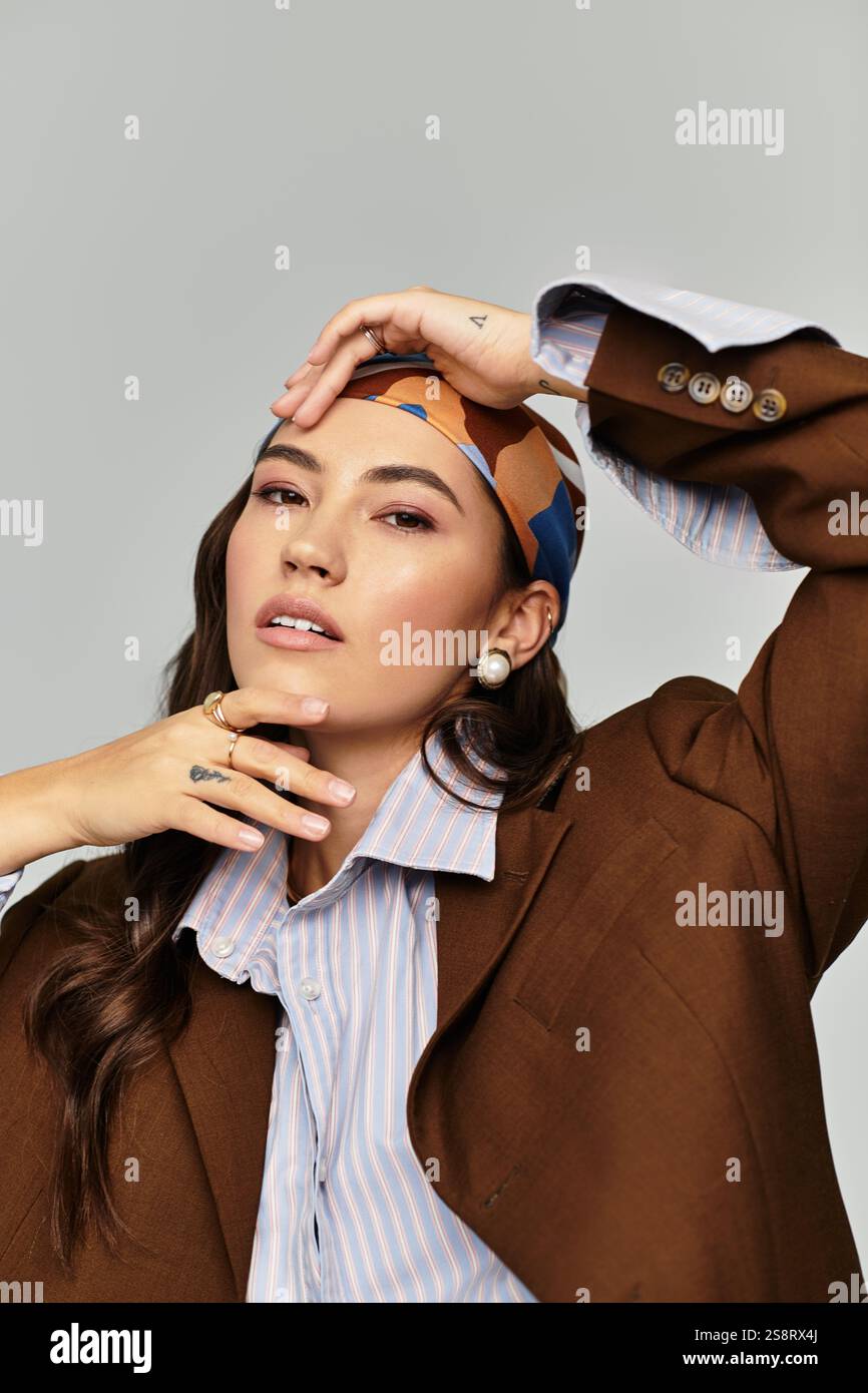 A beautiful woman poses gracefully, combining fashion and elegance in ...