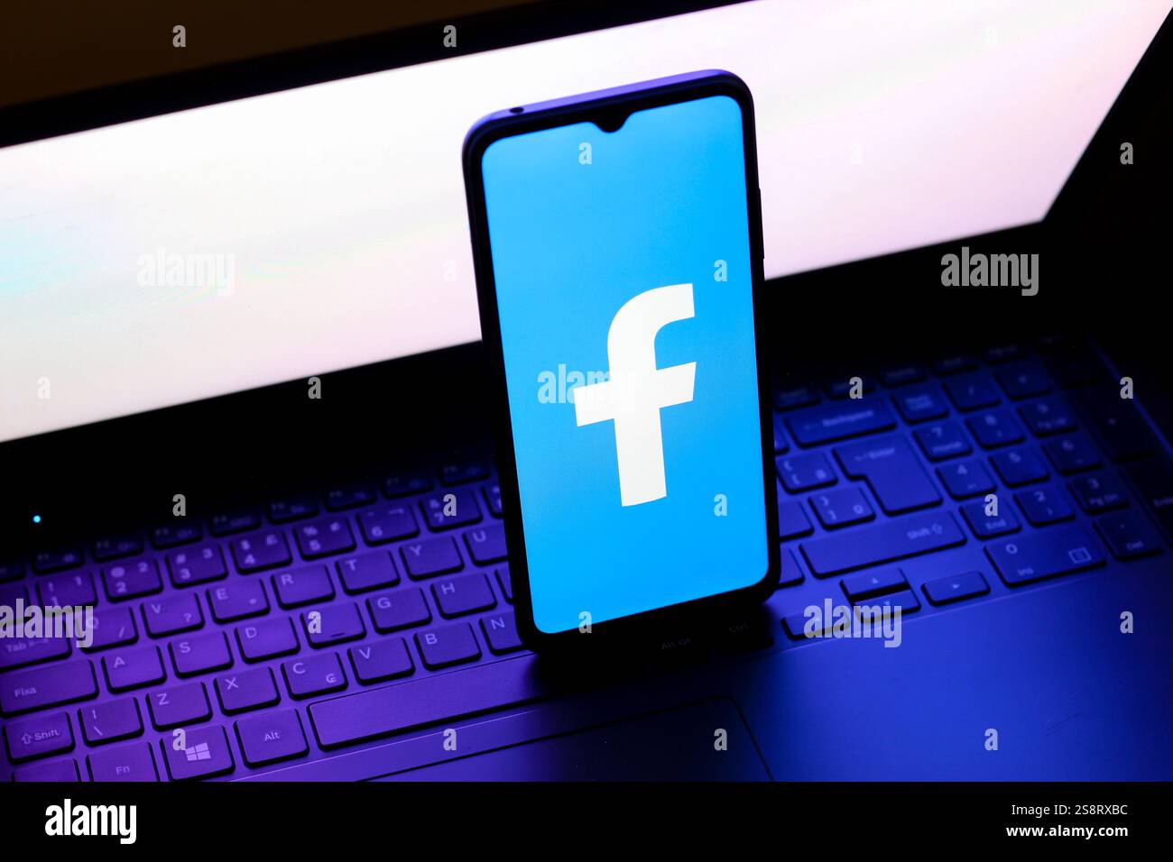 In this photo illustration, the Facebook logo is seen displayed on a ...