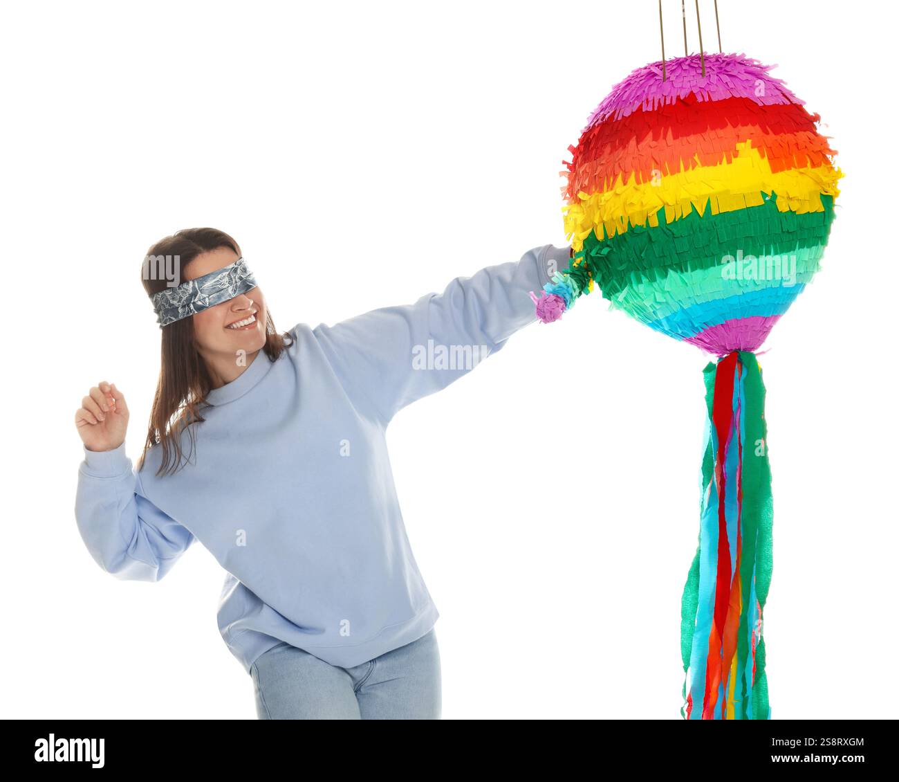 Woman with tied eyes breaking pinata on white background Stock Photo ...