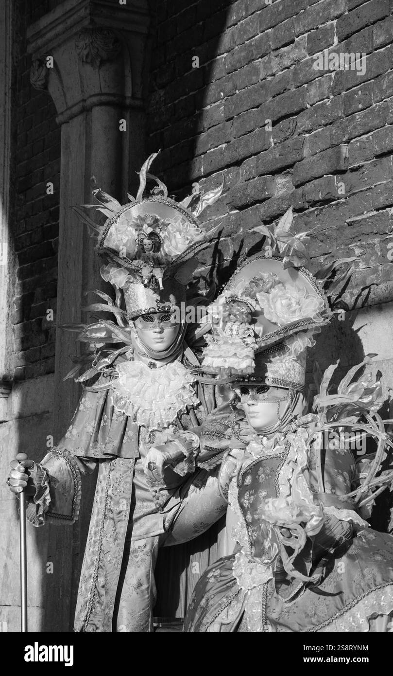 Two noble masks in golden sunlight near Doge's Palace in St Mark's ...