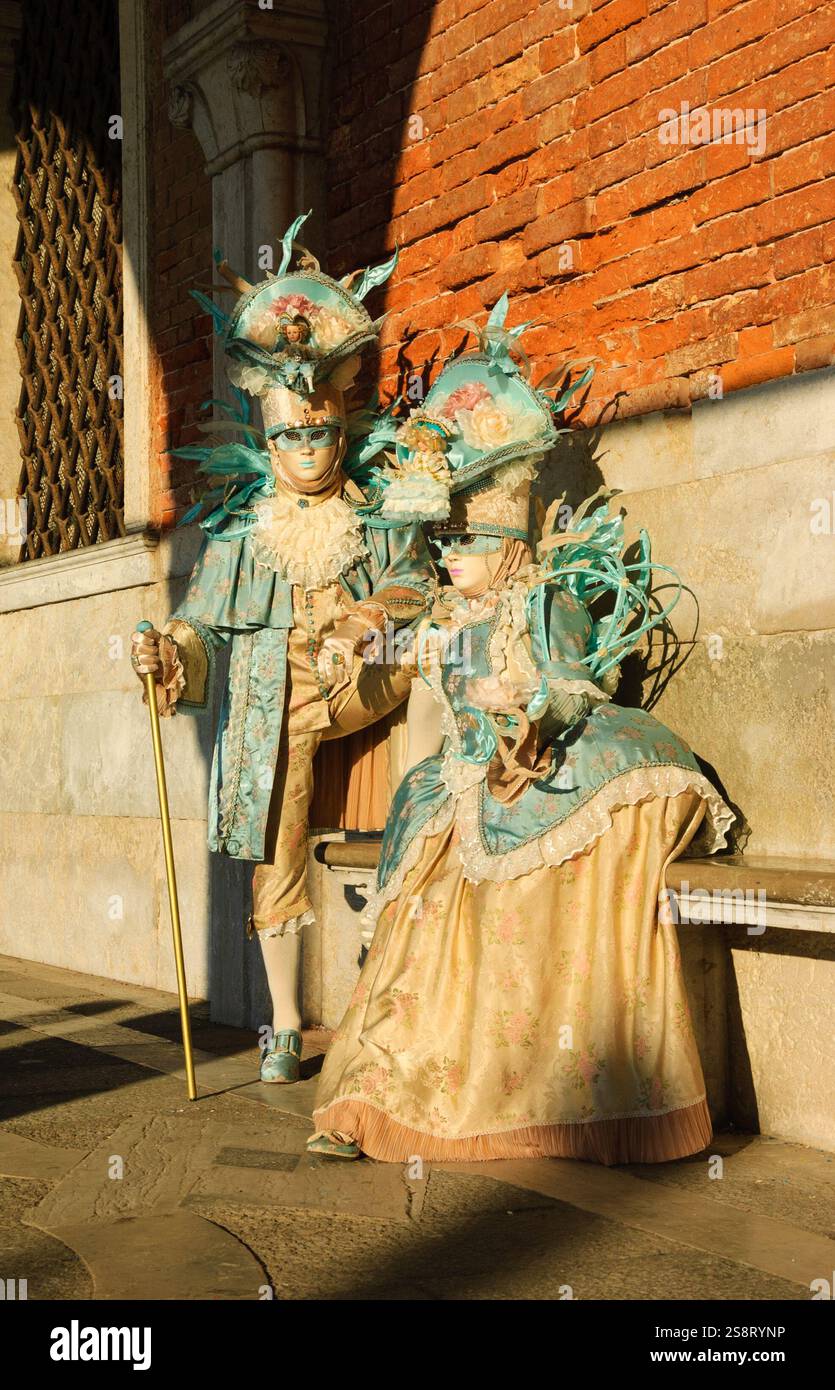 Two noble masks in golden sunlight near Doge's Palace in St Mark's ...