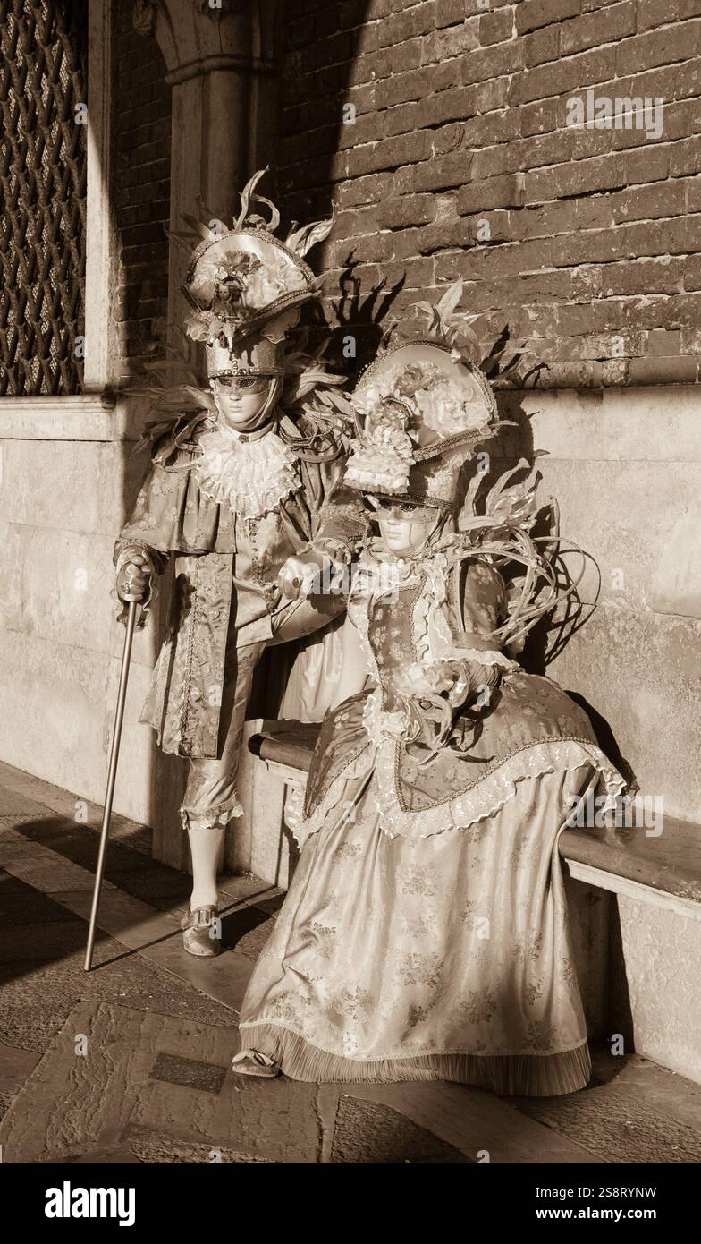 Two noble masks in golden sunlight near Doge's Palace in St Mark's ...
