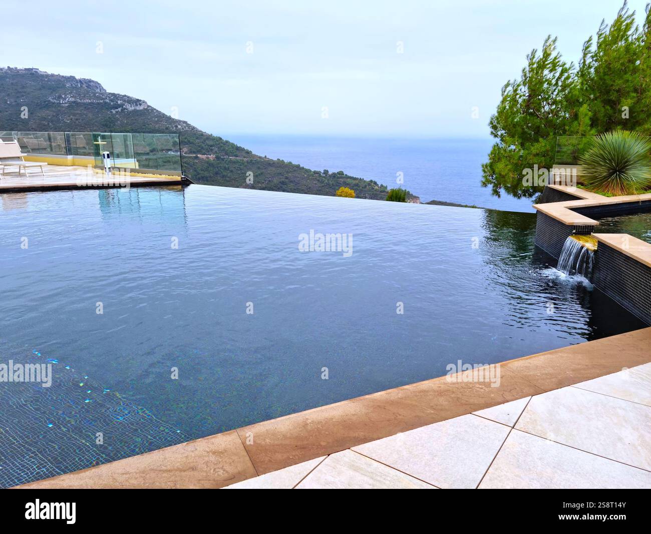Swimming pool with sea view Stock Photo - Alamy