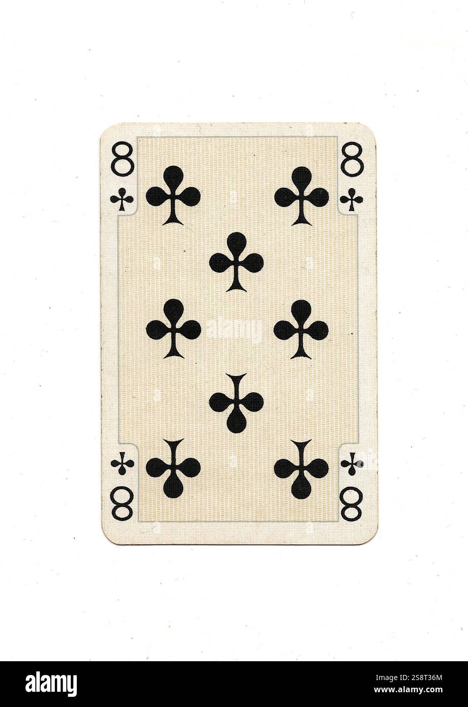 An antique eight of clubs playing card isolated on a white background ...