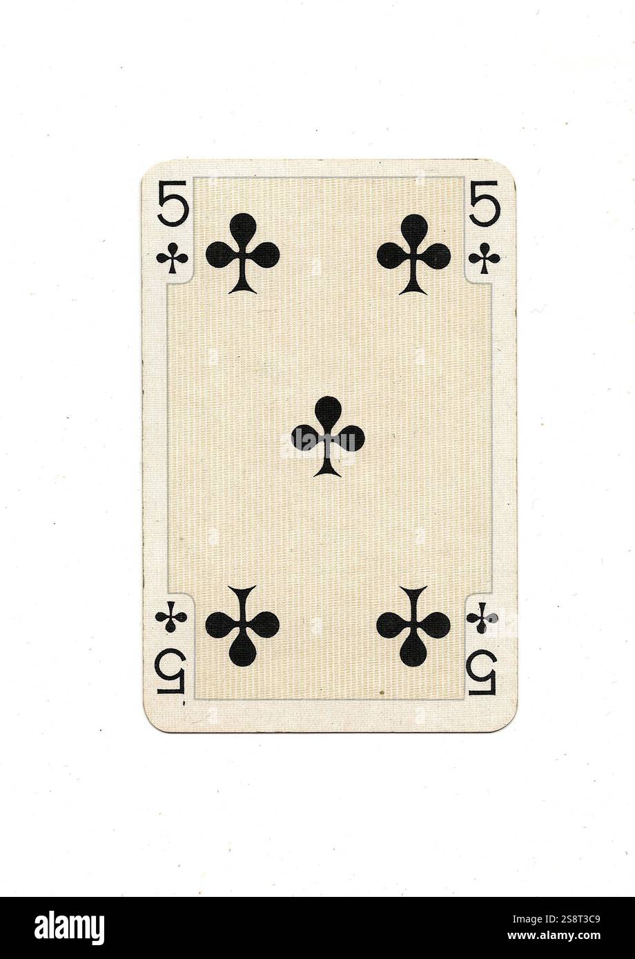 An antique five of clubs playing card isolated on a white background ...