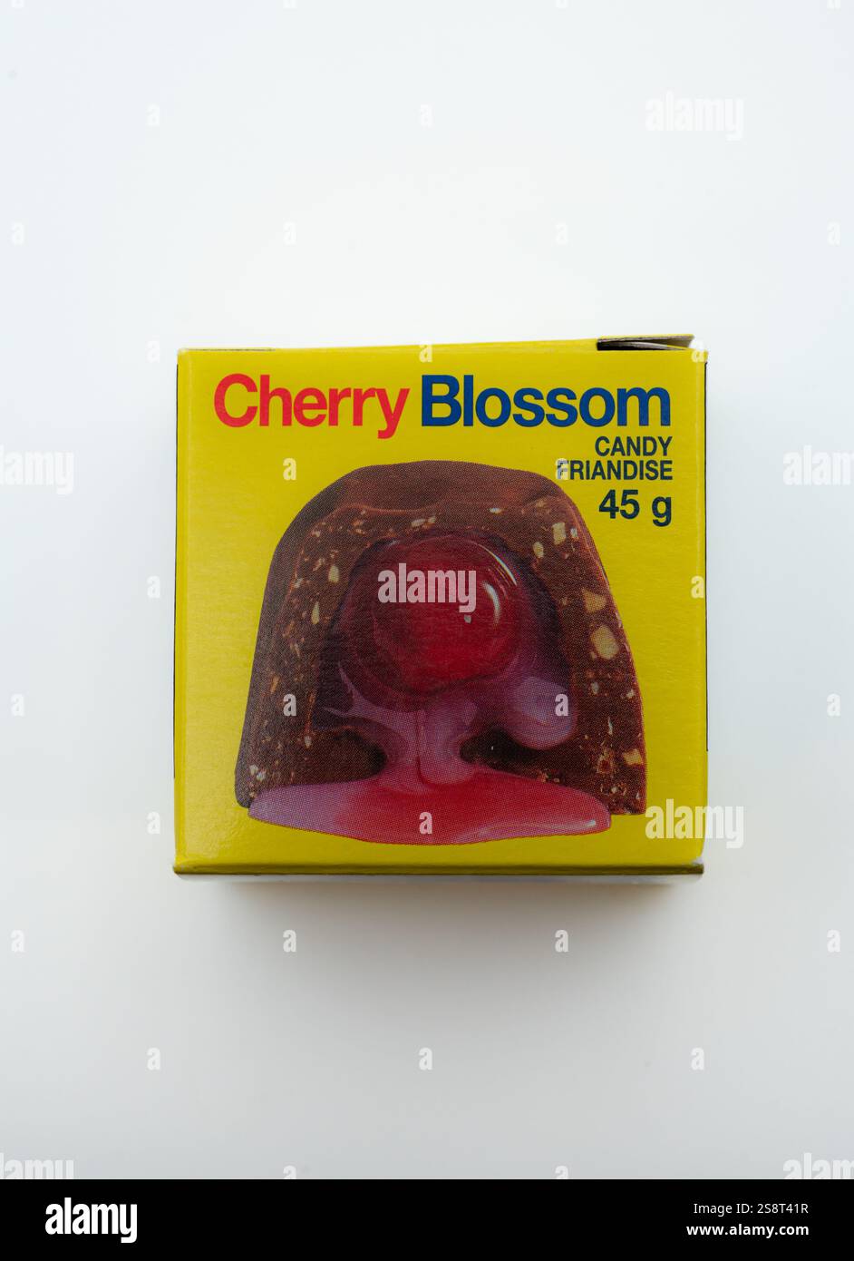 A box of Cherry Blossom candy, featuring vibrant yellow packaging and ...