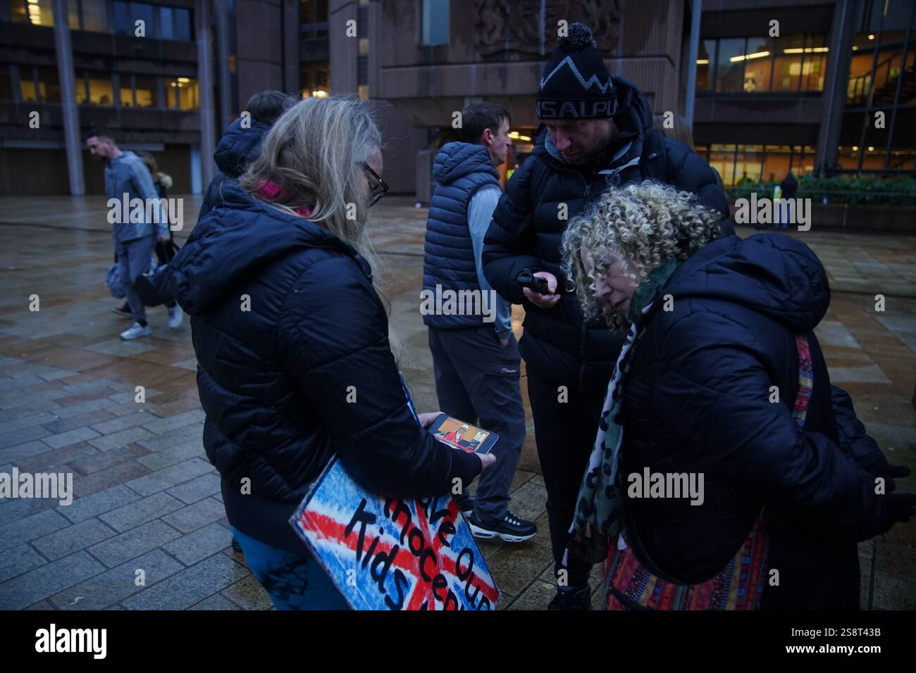 Members of the public watch judge Mr Justice Goose, summing up at ...