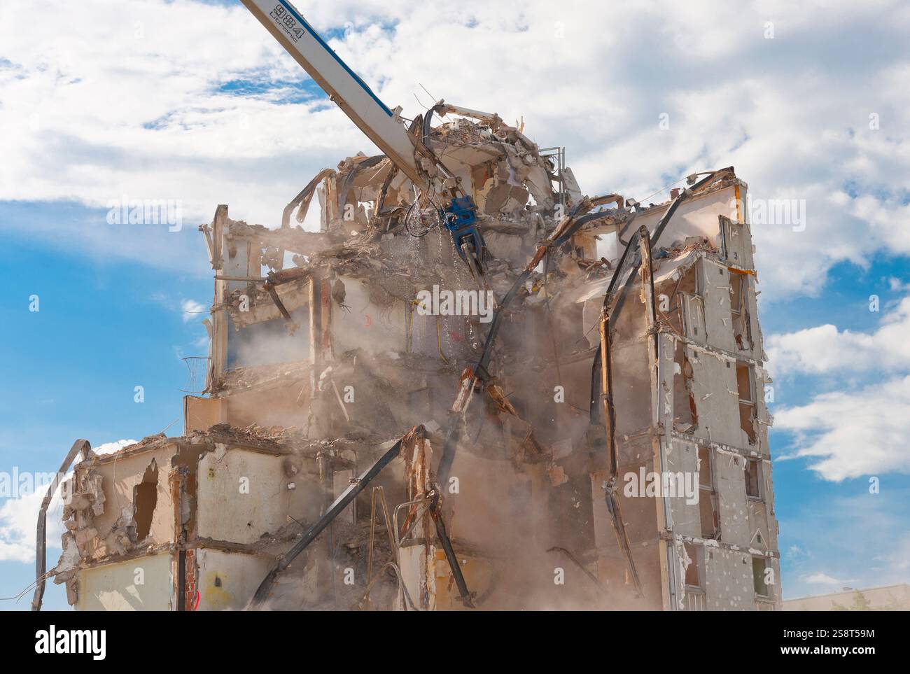 Close-up of a building being demolished. Interlocking steel beams and ...