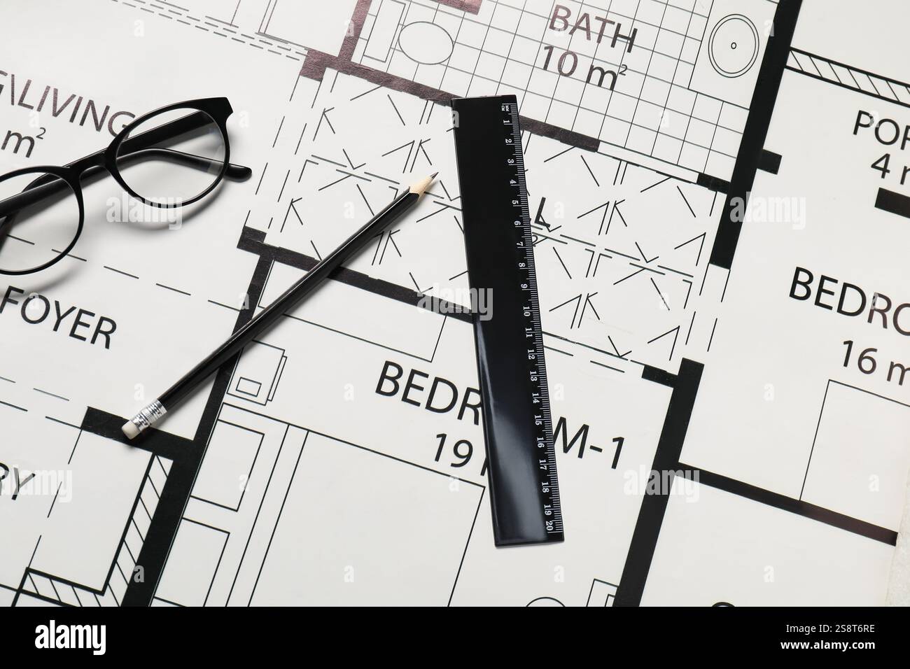 Ruler, glasses and pencil on different architectural drawings, top view ...