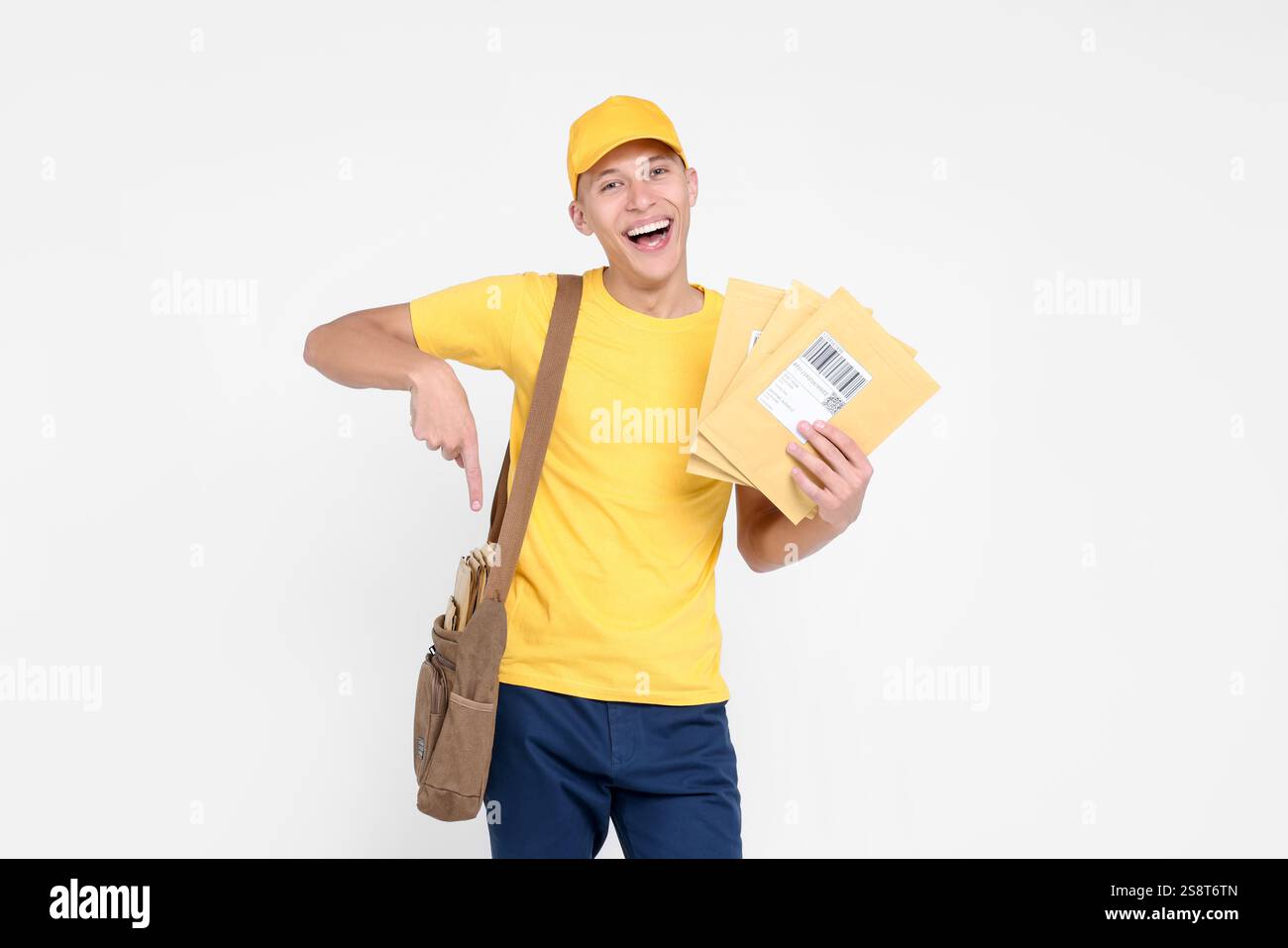 Happy postman with envelopes pointing at bag on white background Stock ...