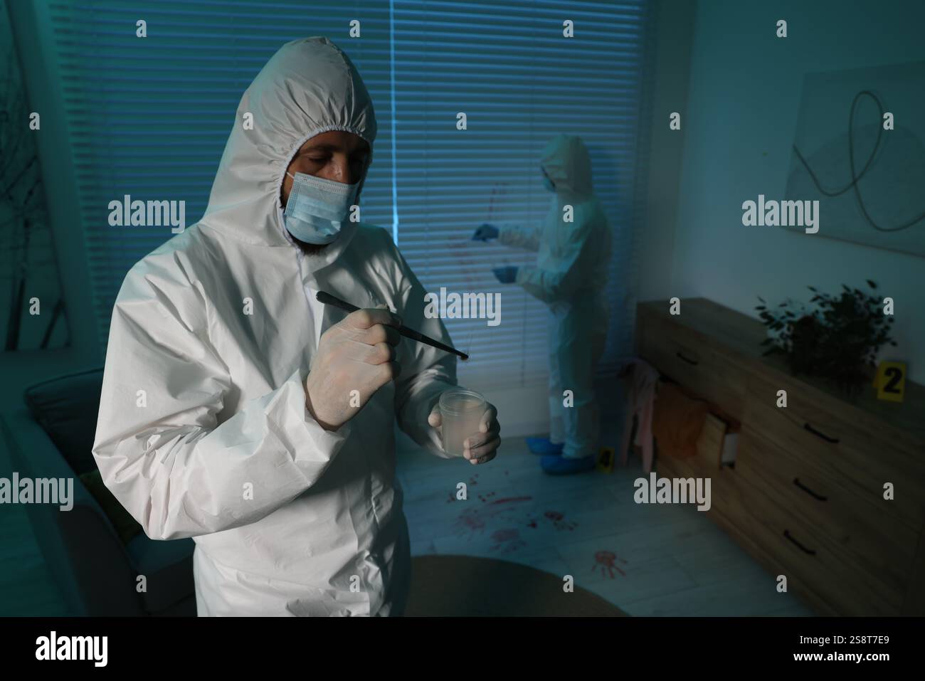 Forensic experts working at crime scene indoors Stock Photo - Alamy