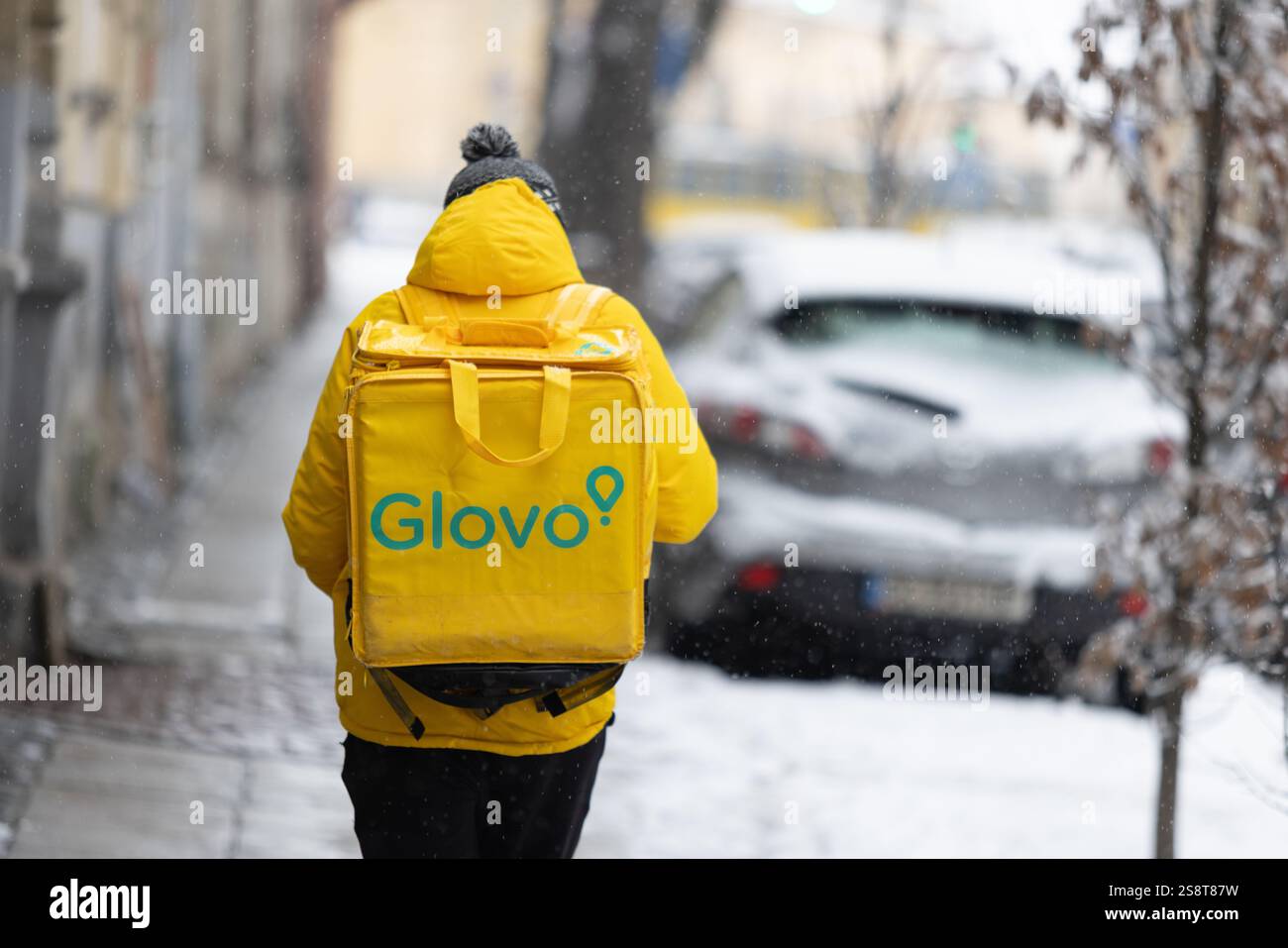 Lviv, Ukraine - January 23, 2025: Glovo delivery man in Lviv city ...