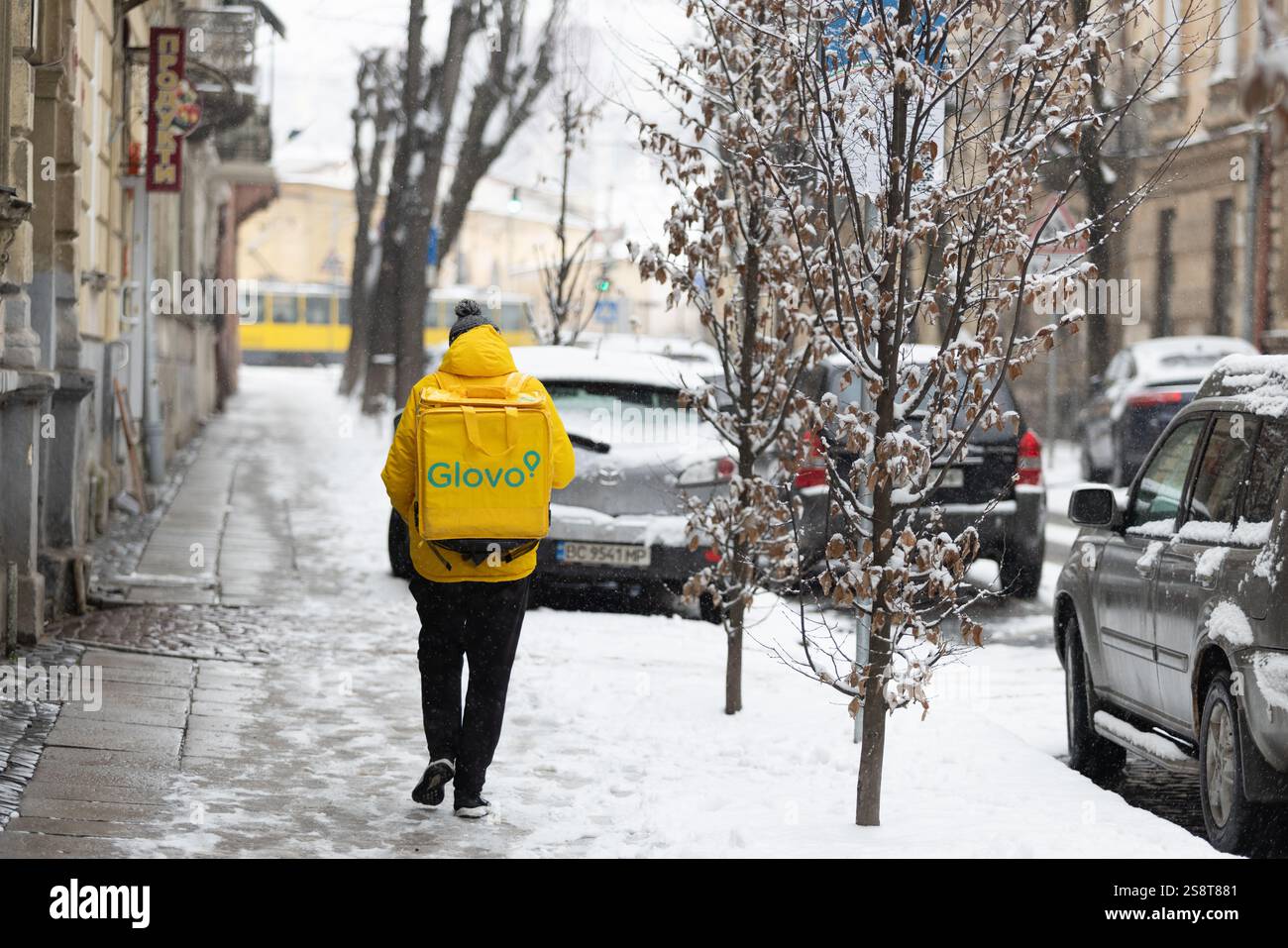 Lviv, Ukraine - January 23, 2025: Glovo delivery man in Lviv city ...