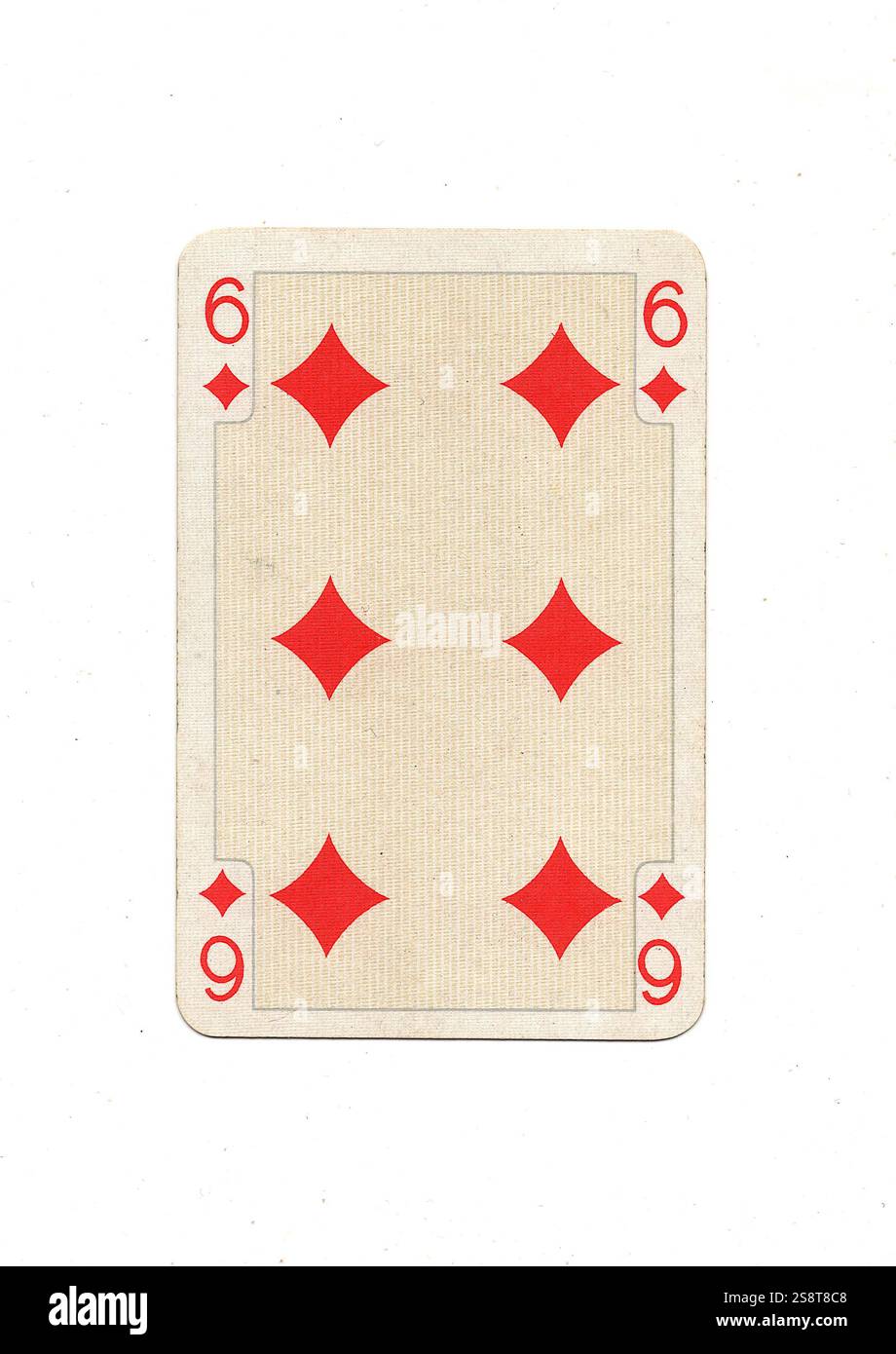 An antique six of diamonds playing card isolated on a white background ...