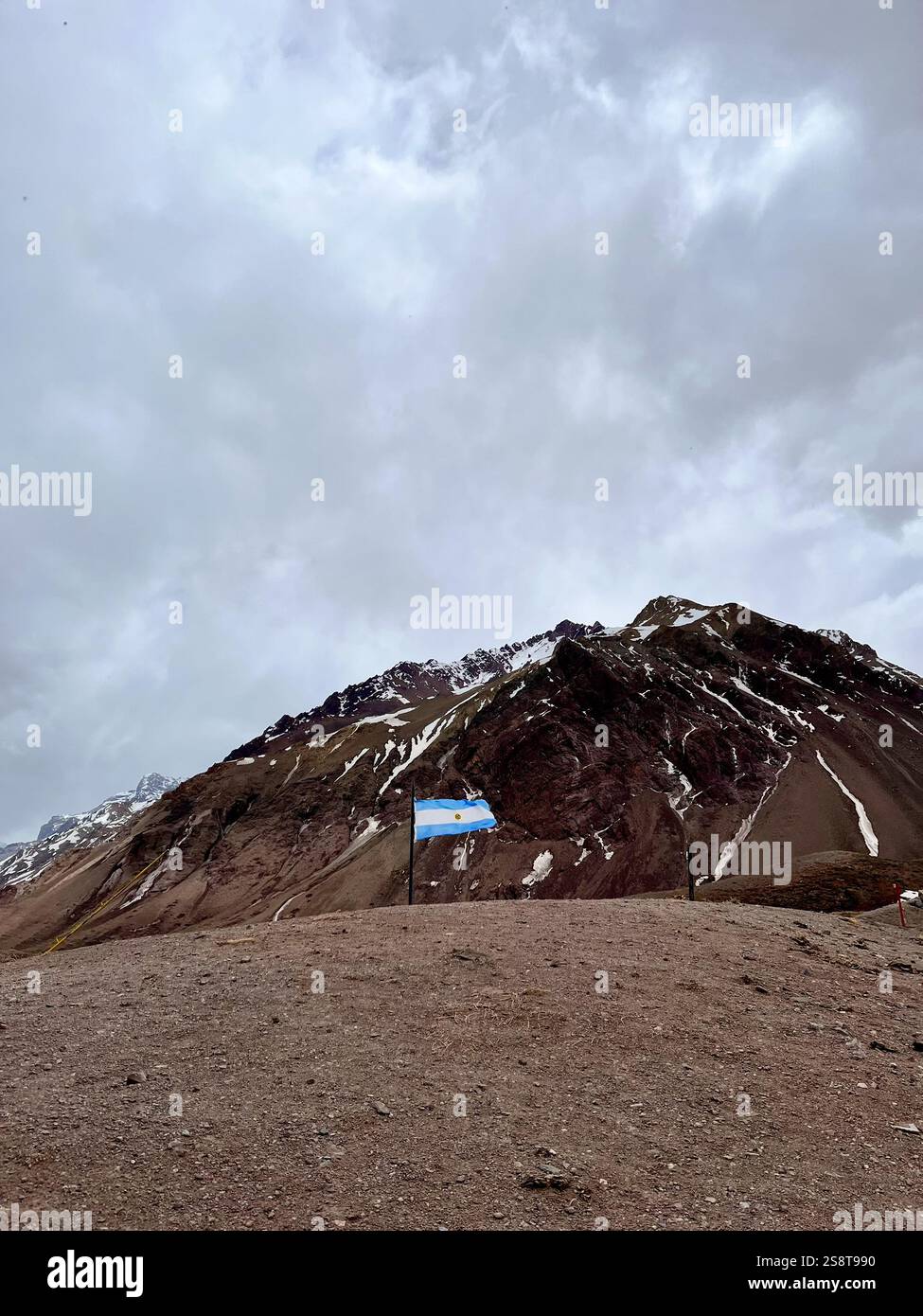 Flying Argentinian flag in Andes Mountains Stock Photo - Alamy