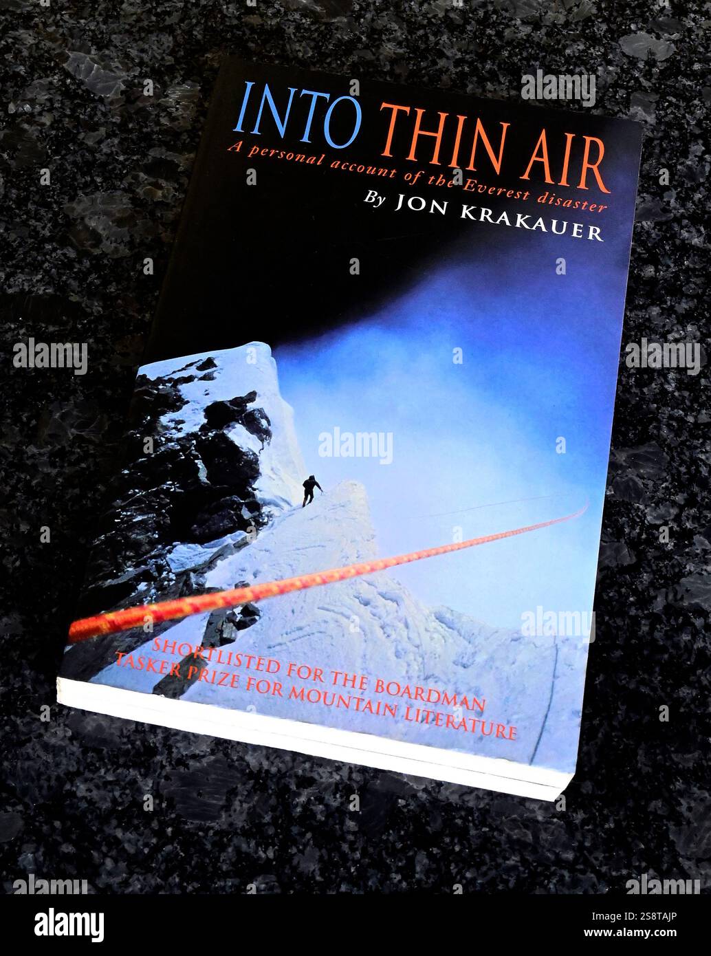 Book cover "Into Thin Air. A personal account of the Everest disaster" by Jon Krakauer Stock ...