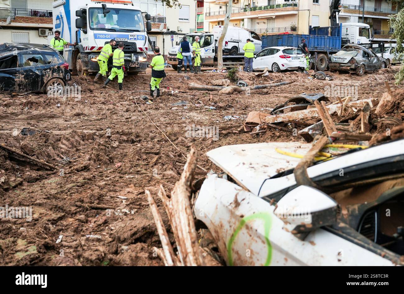 EMT Madrid workers during cleanup operations of crushed cars after DANA ...