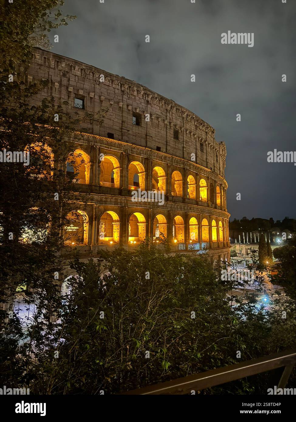 Rome's Coliseum lit at night Stock Photo - Alamy