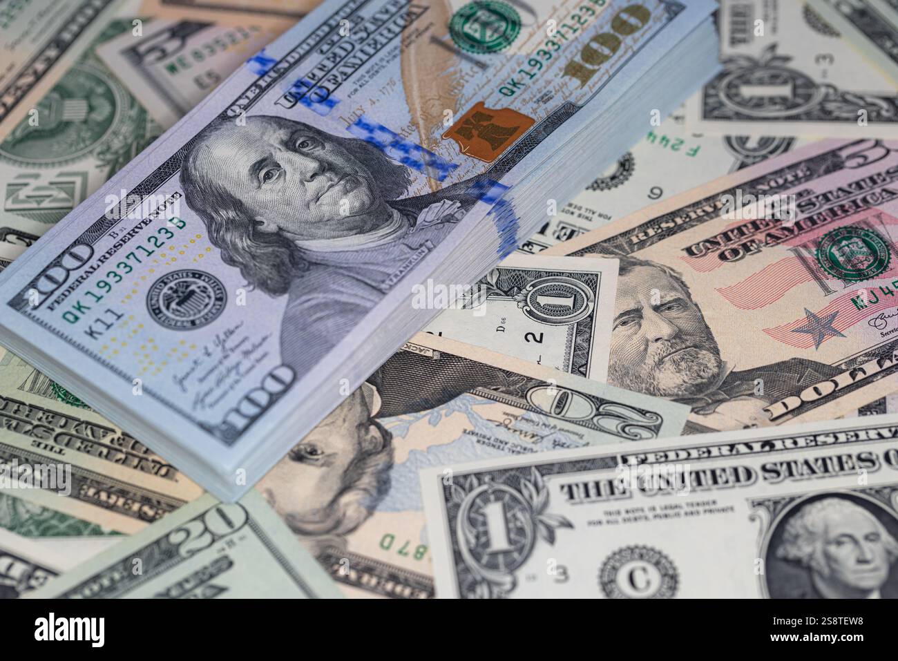 pile of US 100 dollar banknotes on spread dollar banknotes for design ...