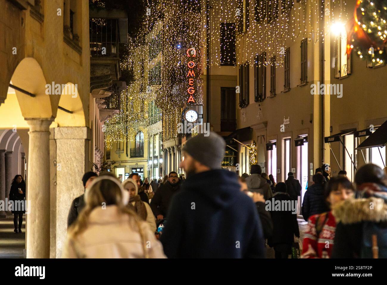 Lugano, Switzerland - Dec 22, 2024: A festive street with holiday ...