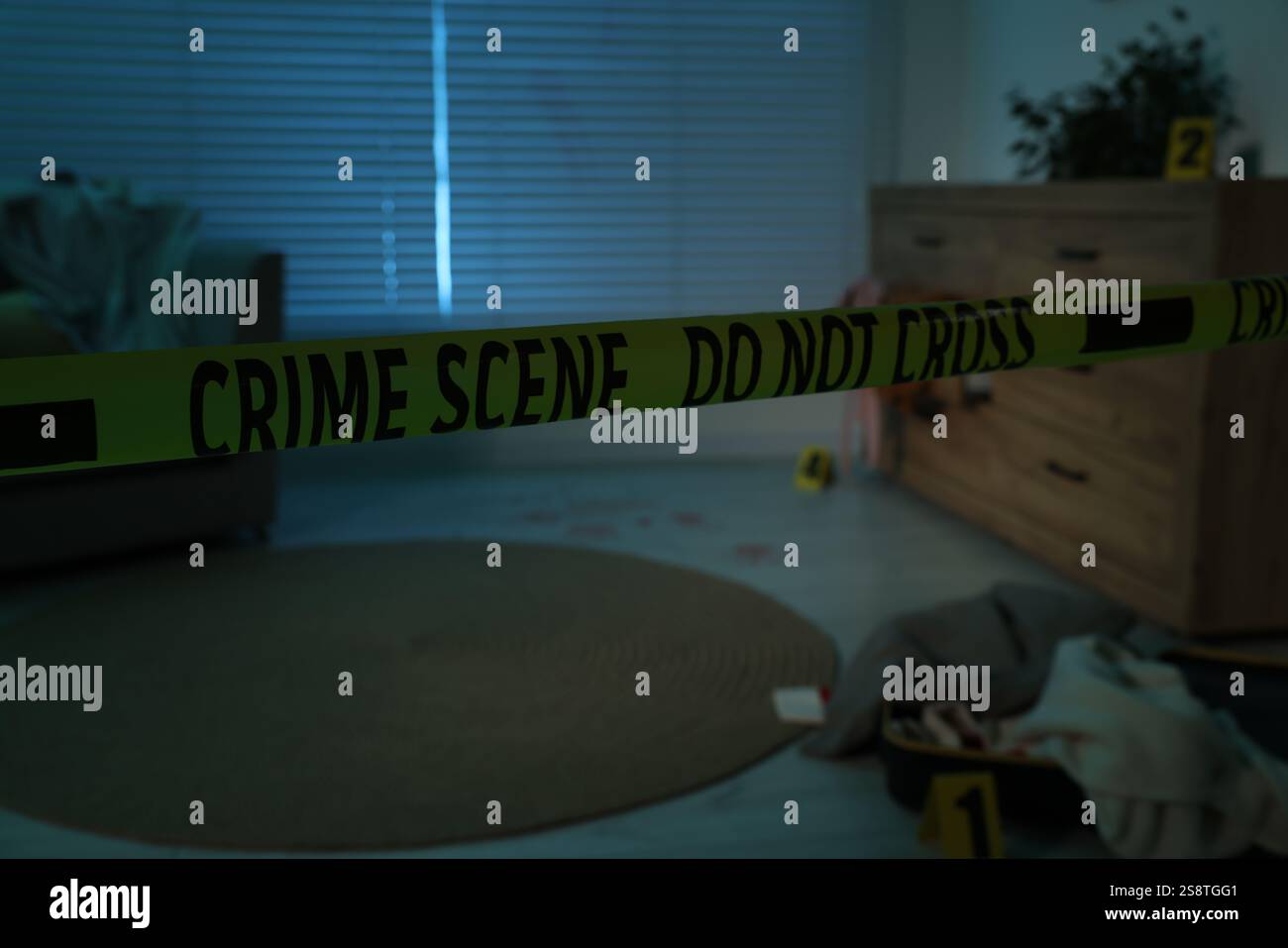 Yellow crime scene tape blocking way to messy room Stock Photo - Alamy