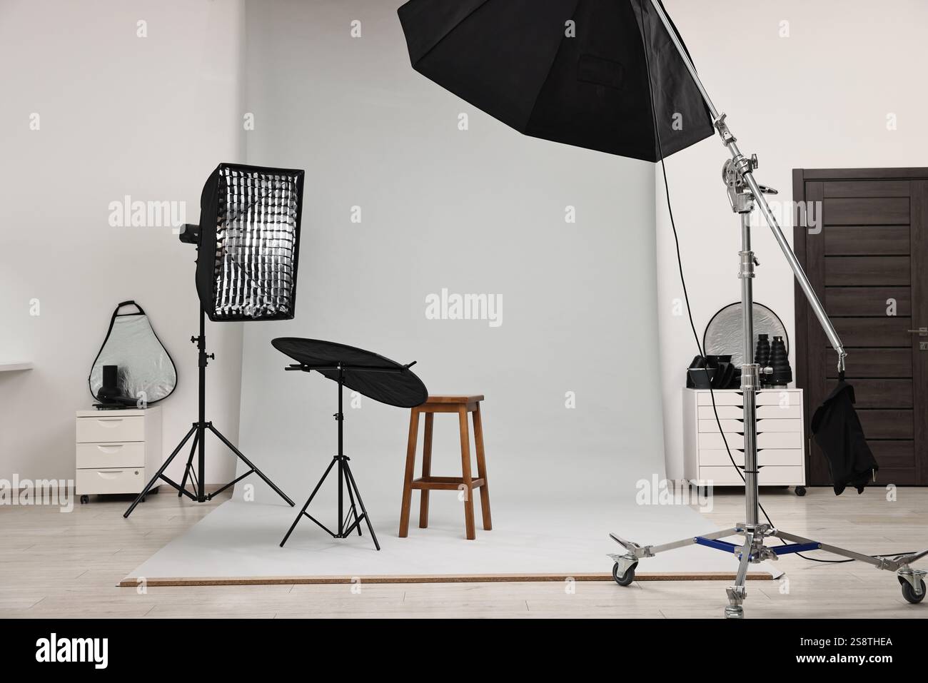 Professional lighting equipment setup in modern photo studio Stock ...
