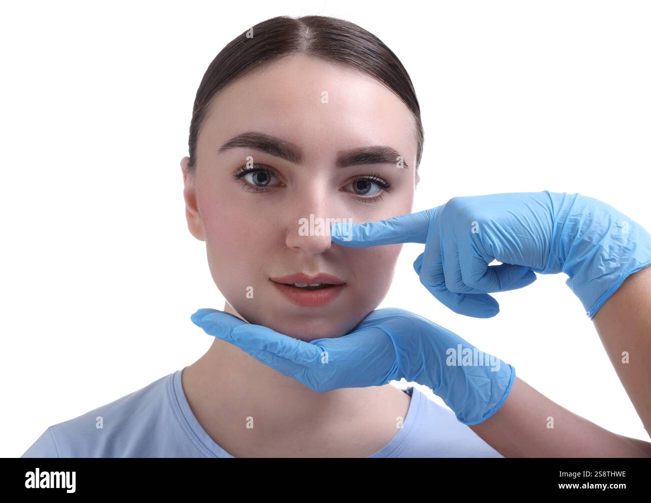 Doctor checking patient's nose before plastic surgery operation on ...