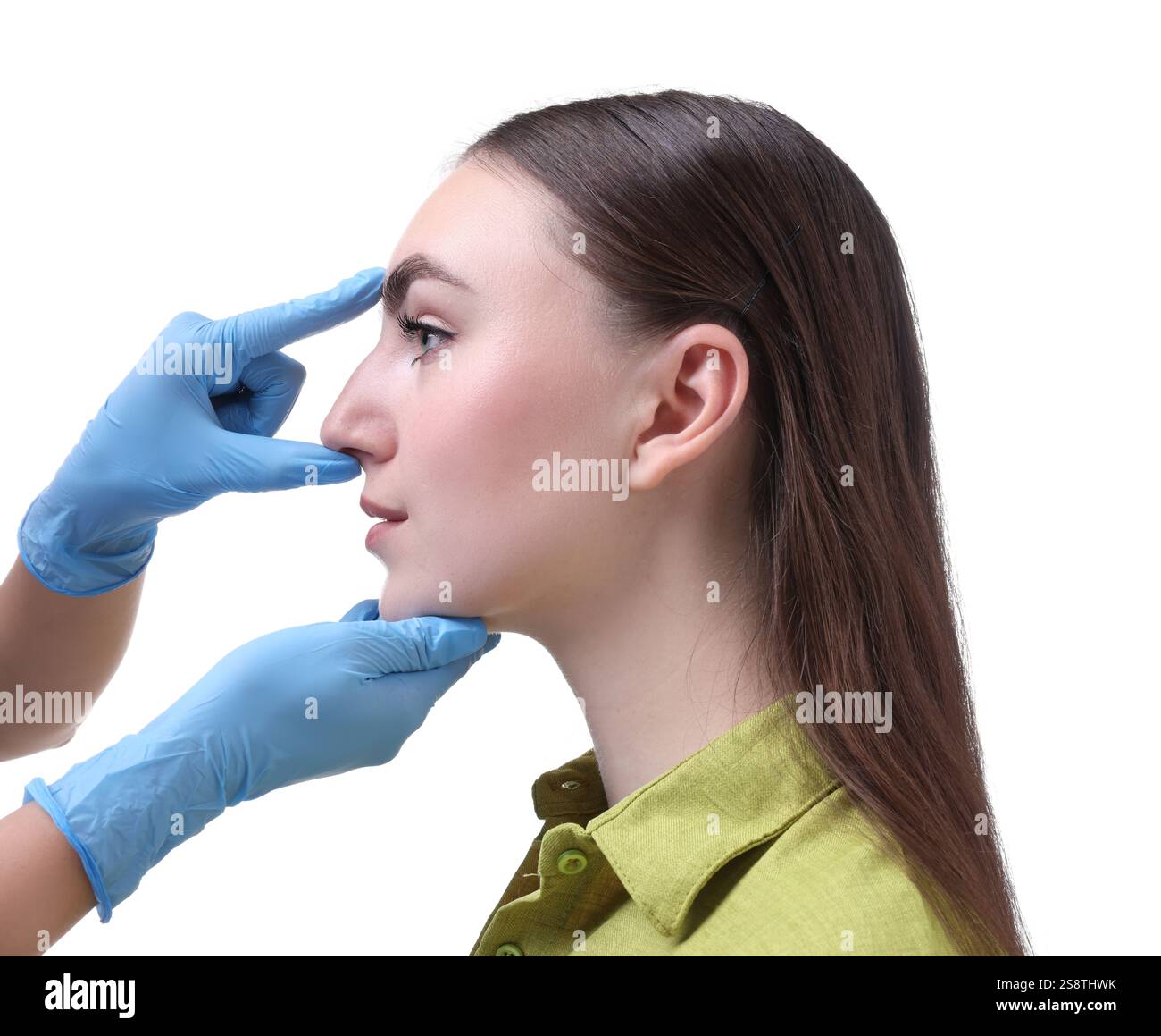 Doctor checking patient's nose before plastic surgery operation on ...