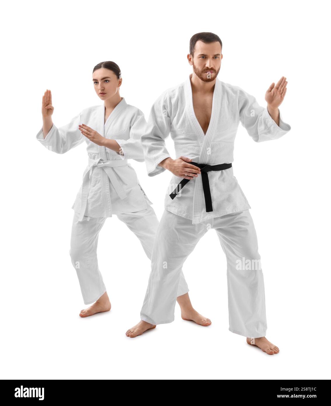 Karate fighters in uniform on white background Stock Photo - Alamy