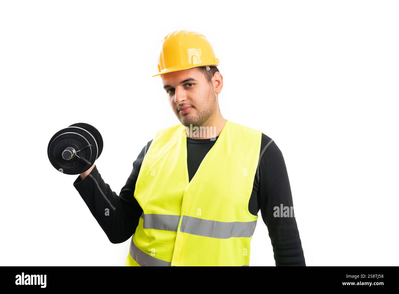 Fit male constructor doing weightlifting exercise using dumbbell in ...