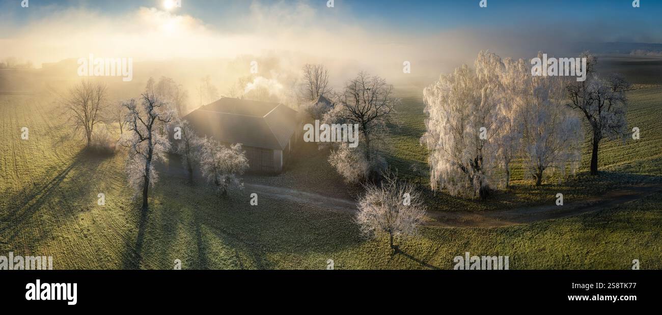 Winter wonderland idyll with an old European farmhouse. Panoramic ...