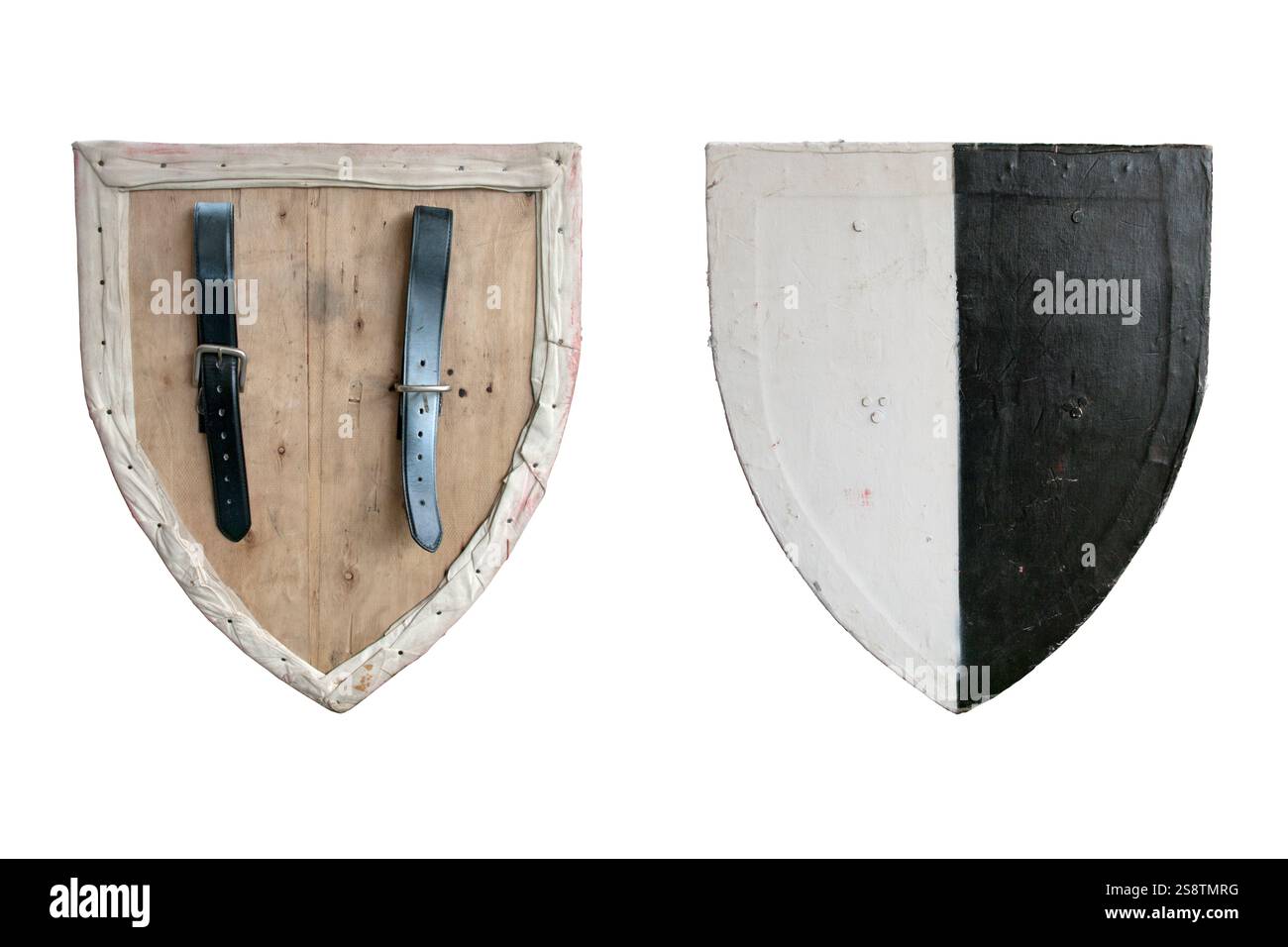 The front and back of a replica medieval shield, painted black and ...