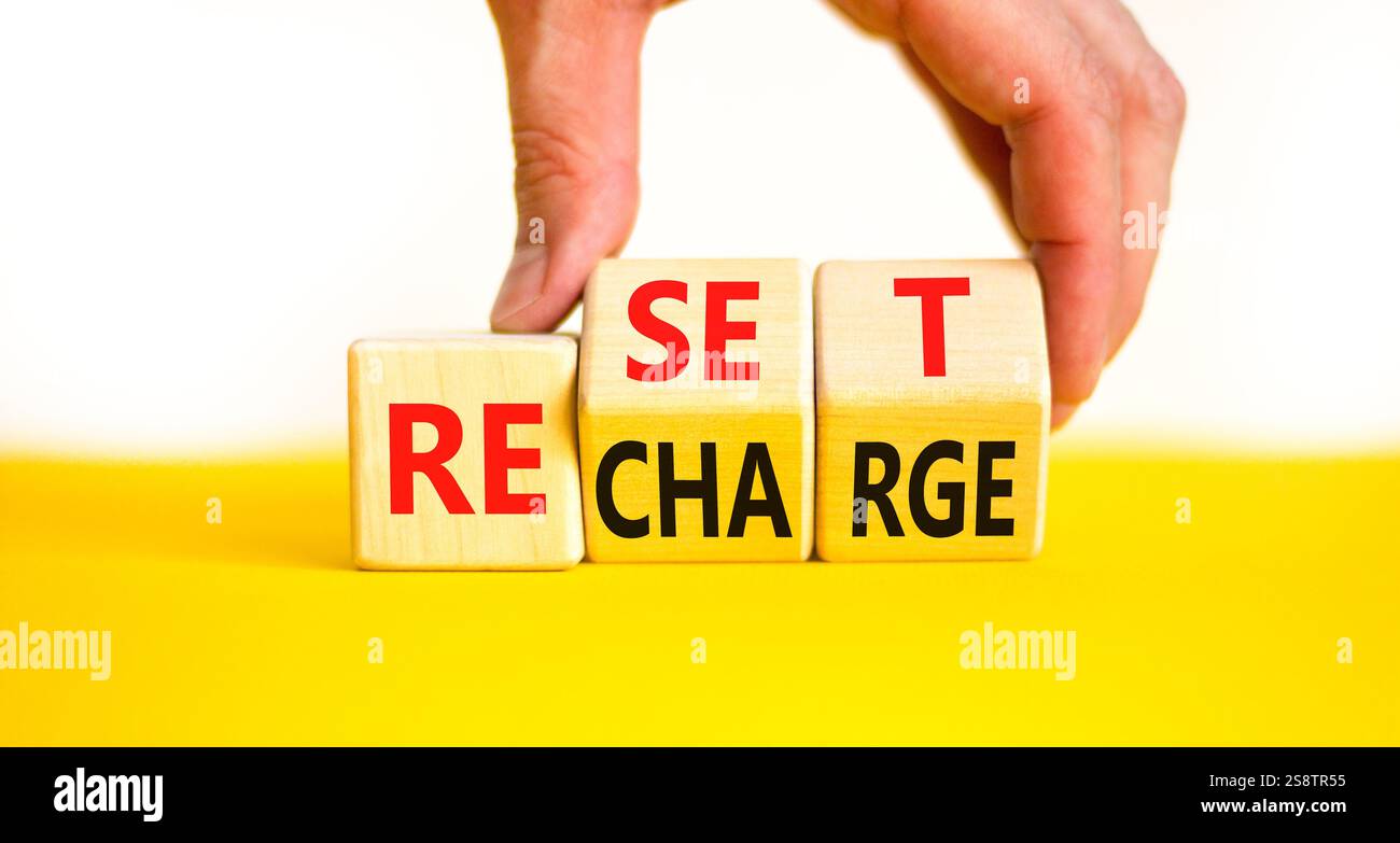 Reset and recharge symbol. Concept words Reset Recharge on beautiful wooden block. Beautiful ...
