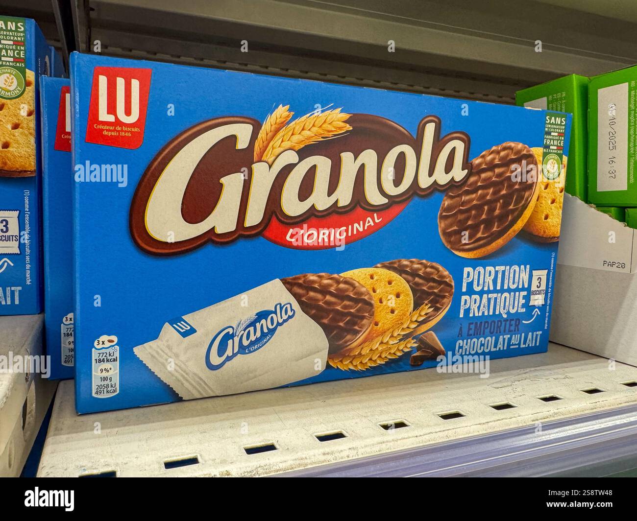 Granola cookies displayed on a supermarket shelf with vibrant packaging ...