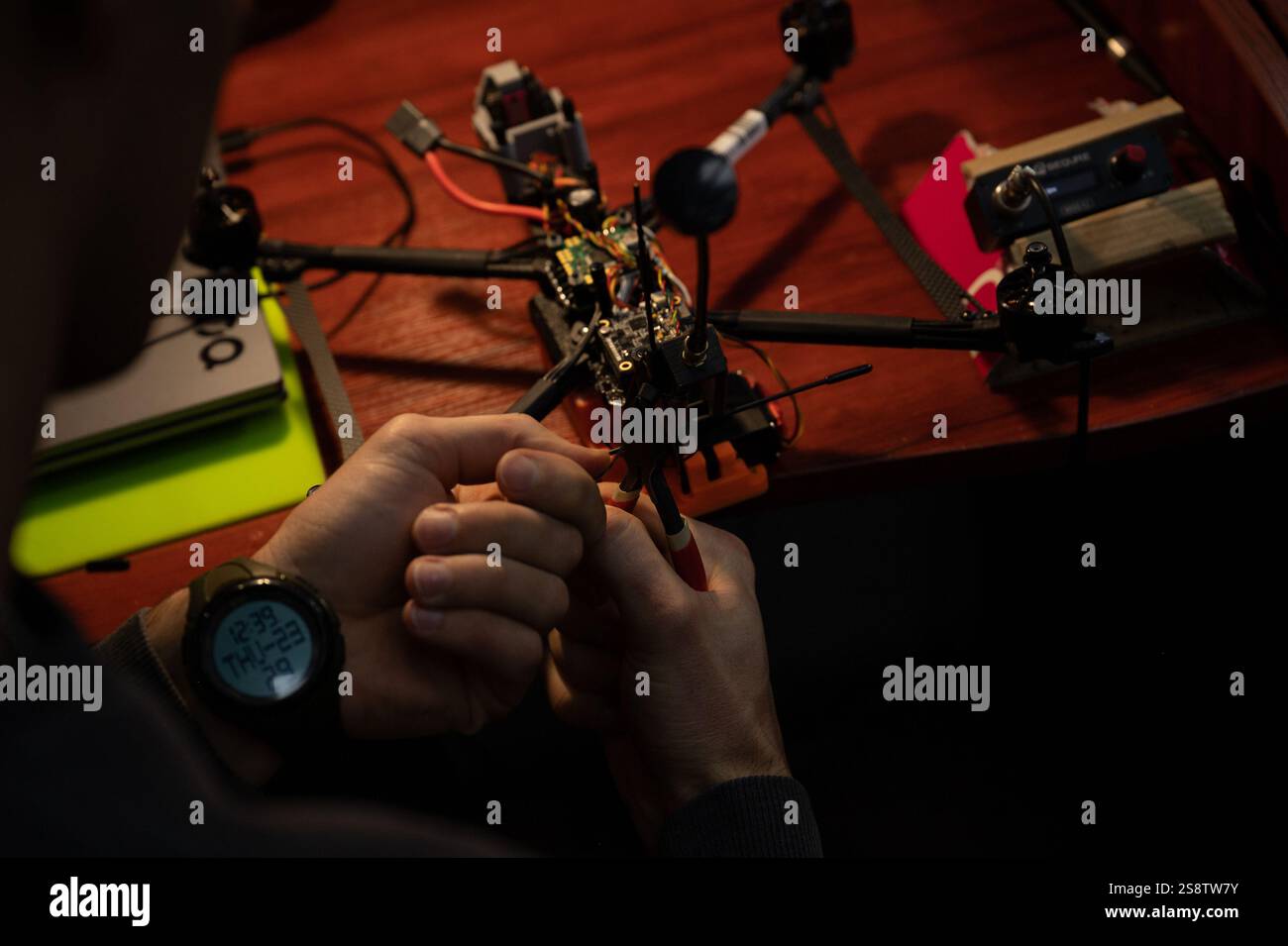 A member of the Ukrainian military assembles a drone at a clandestine ...