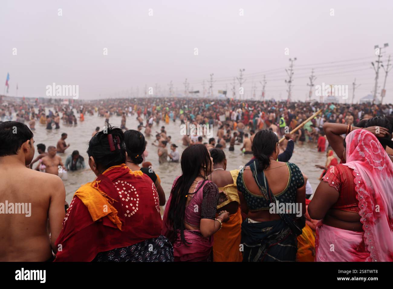 Pilgrims bathing in the Ganges at the Triveni Sangam on the auspicious ...