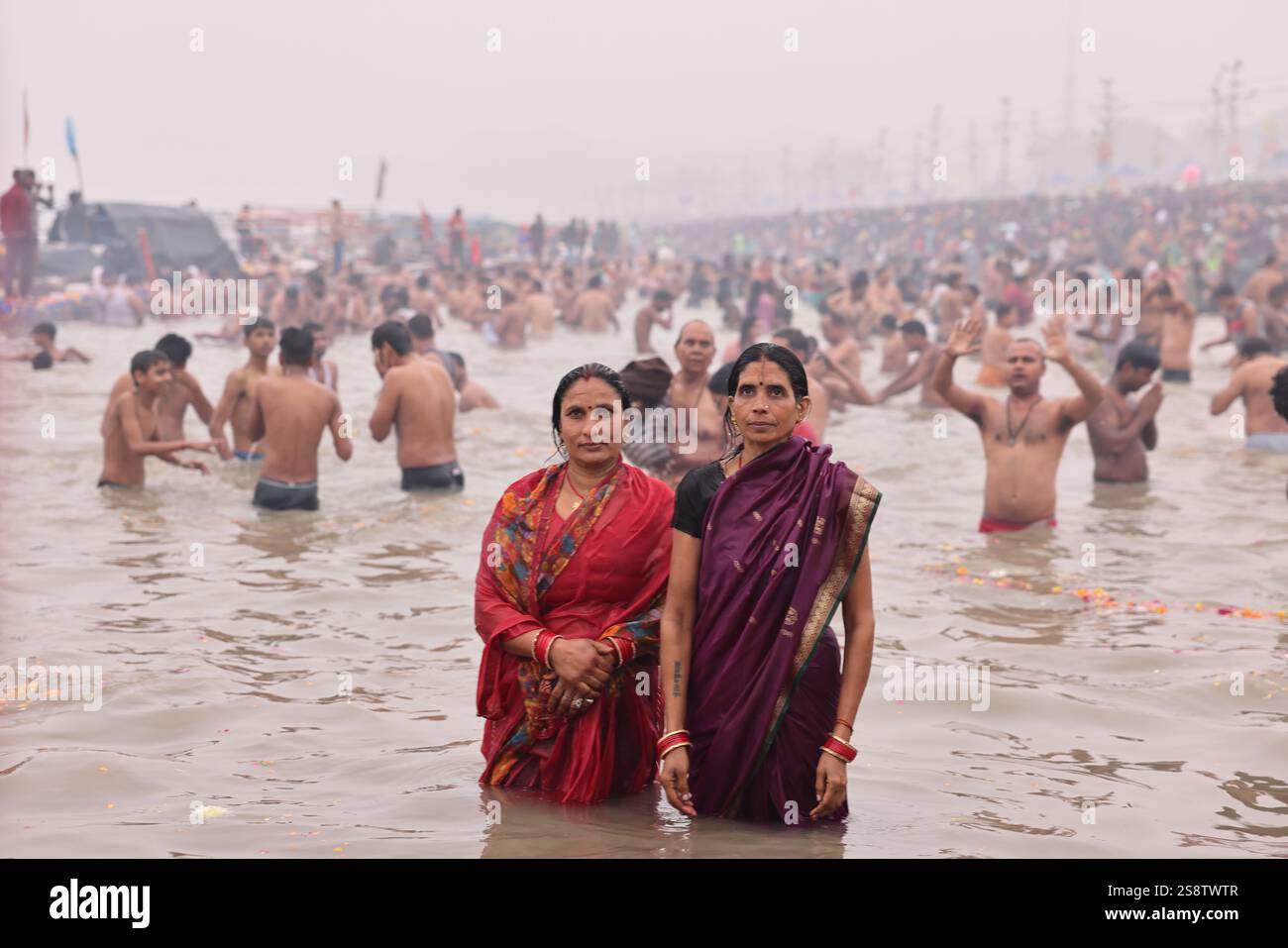 Pilgrims bathing in the Ganges at the Triveni Sangam on the auspicious ...