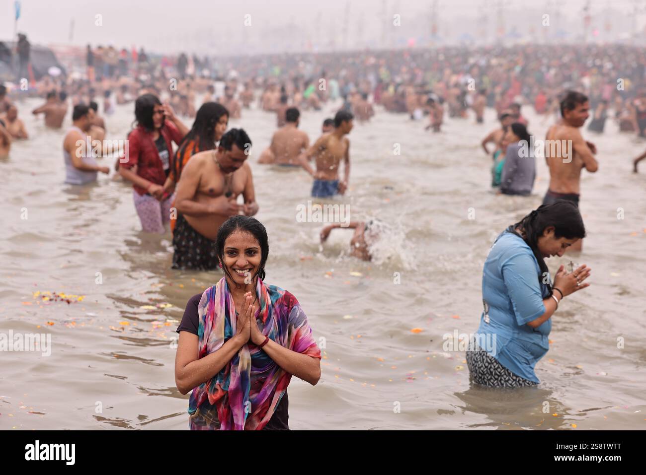 Pilgrims bathing in the Ganges at the Triveni Sangam on the auspicious ...