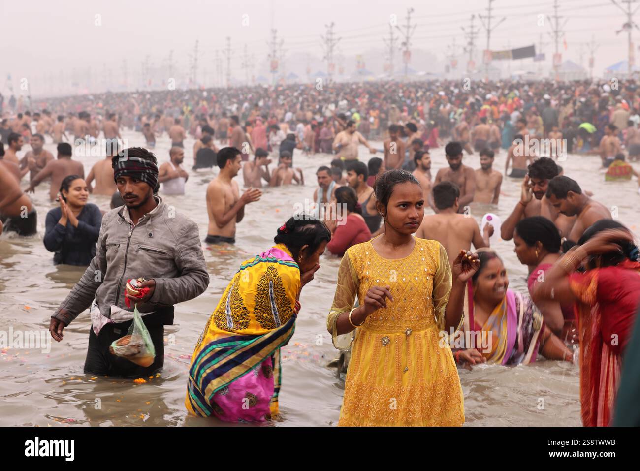 Pilgrims bathing in the Ganges at the Triveni Sangam on the auspicious ...
