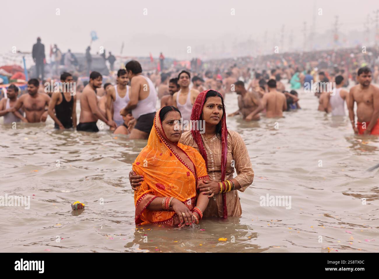 Pilgrims bathing in the Ganges at the Triveni Sangam on the auspicious ...