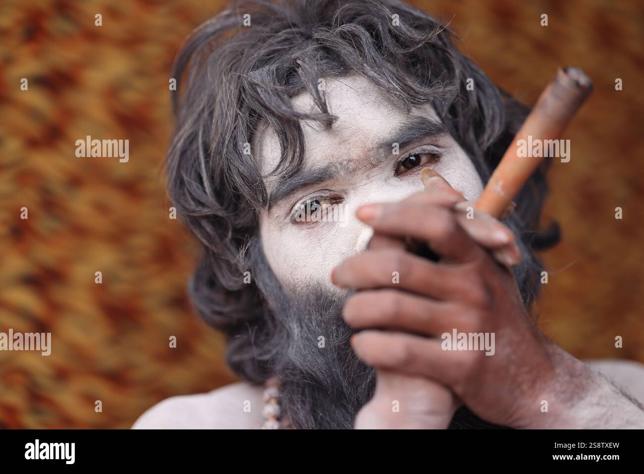 Naga sadhu smoking in an akhara, Maha Kumbh Mela, Prayagraj, Uttar ...
